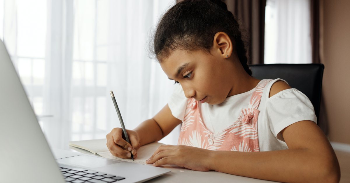 Child Doing Homework With Parent