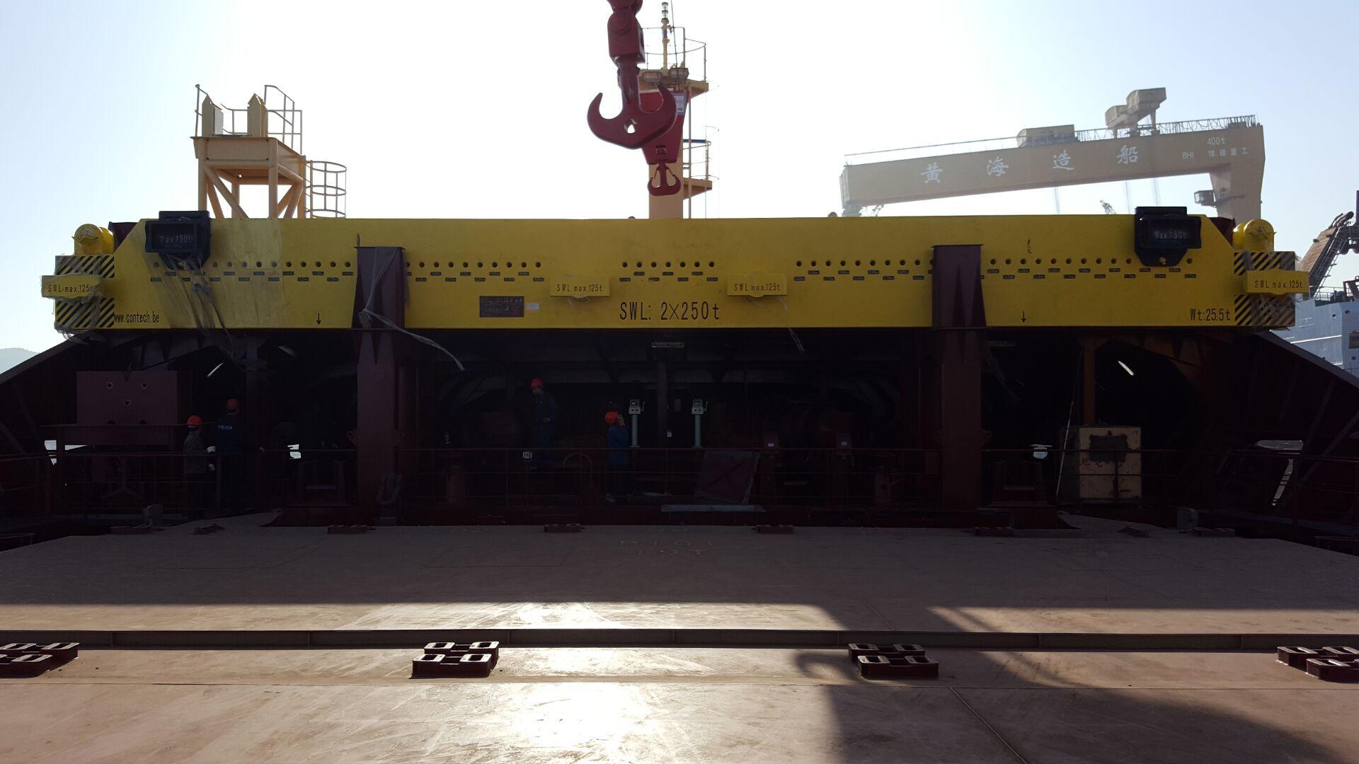 Cargo and container lifting beams and spreaders